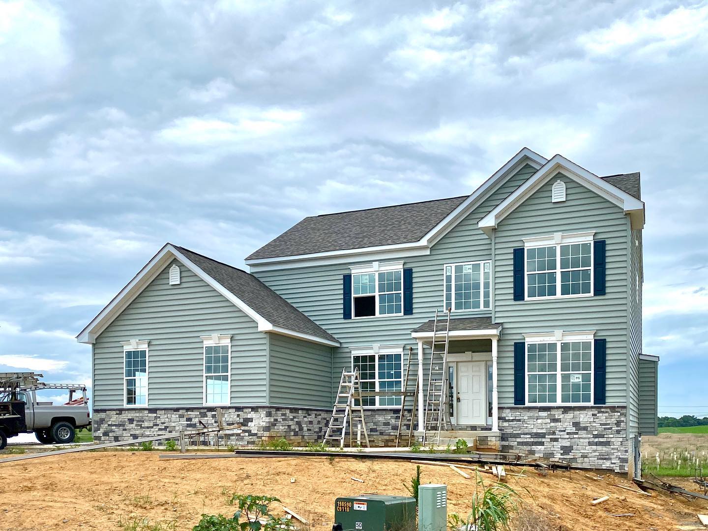 The siding and stonework on this Regency home is g... - Manor House ...